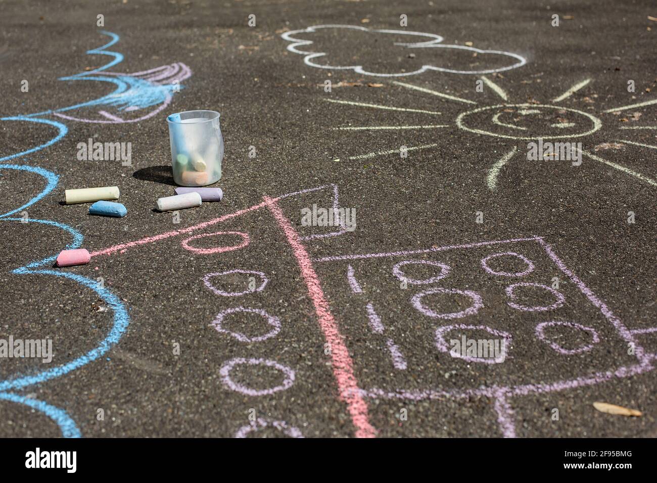 drawings on pavement. children's drawings with crayons on the pavement ...