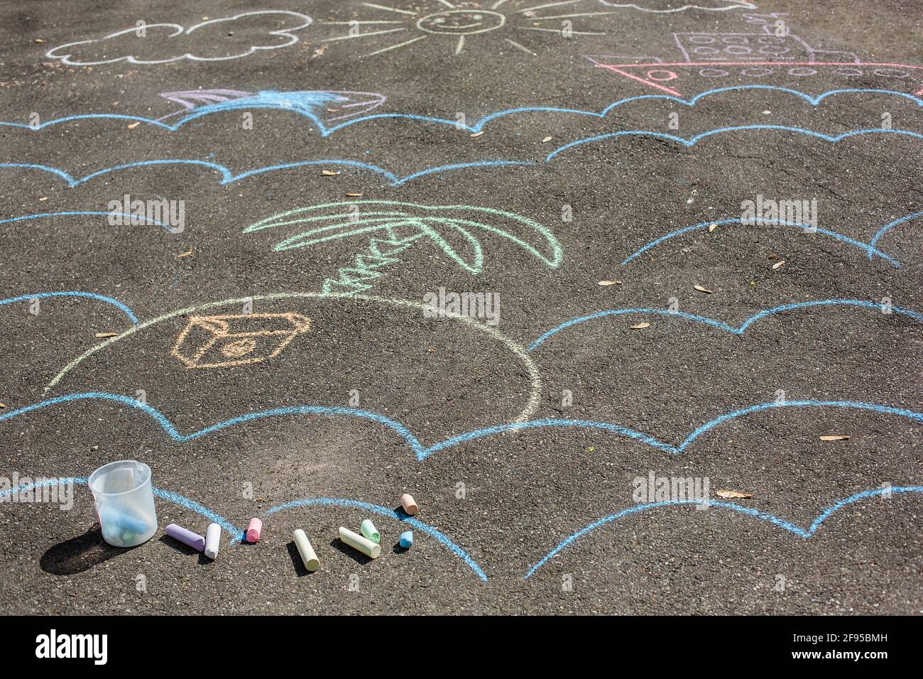 drawings on pavement. children's drawings with crayons on the pavement ...