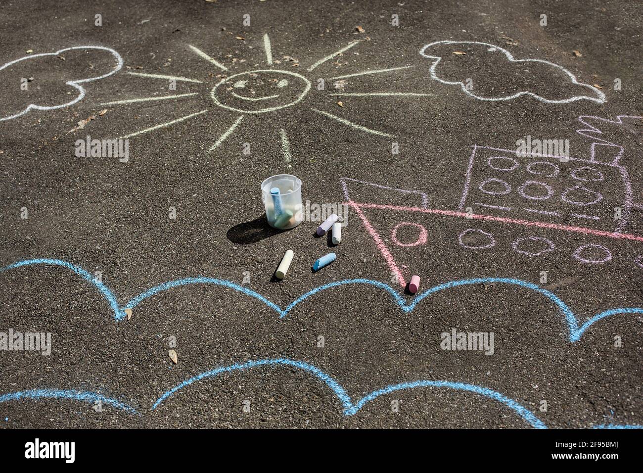 drawings on pavement. children's drawings with crayons on the pavement ...
