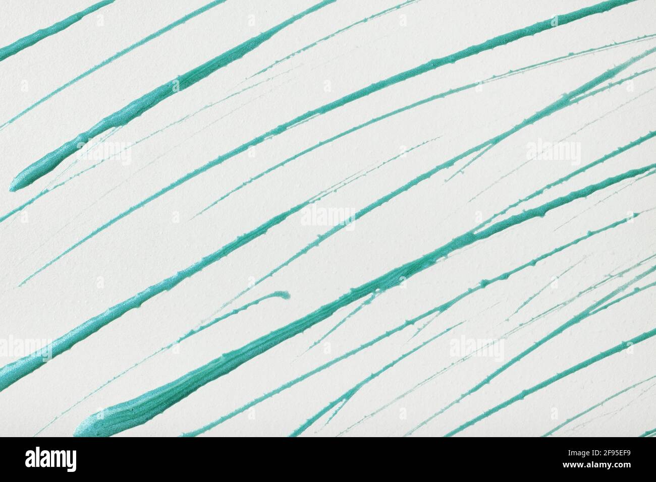 Thin green lines and splashes drawn on white background. Abstract art ...