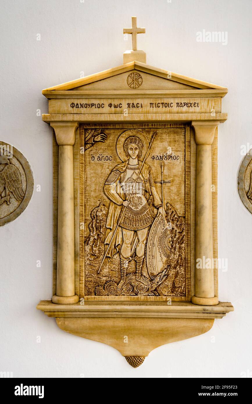 A Greek martyr carved into a church plaque on the Greek Island of ...