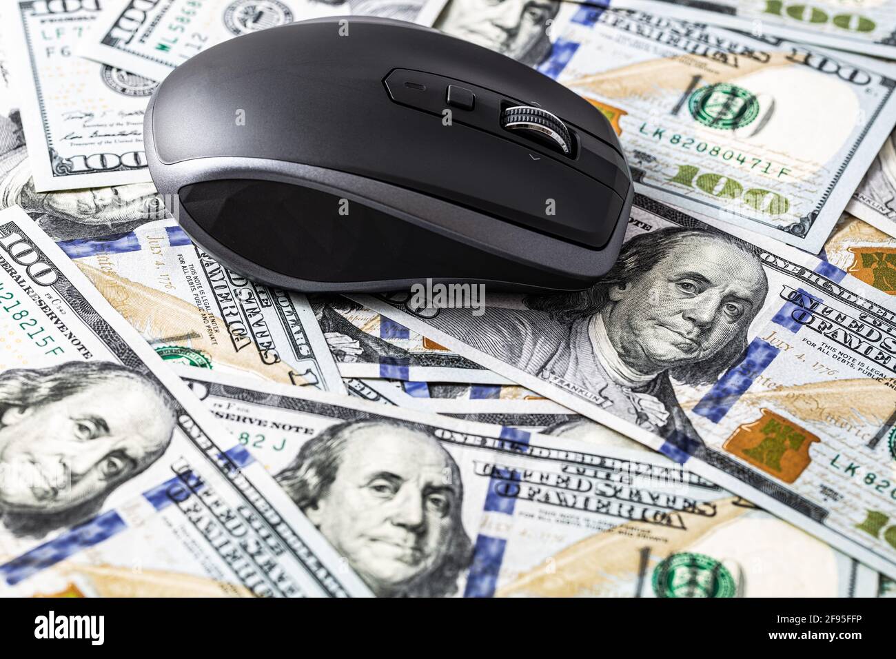 Wireless mobile mouse on 100 dollar background for design purpose Stock ...