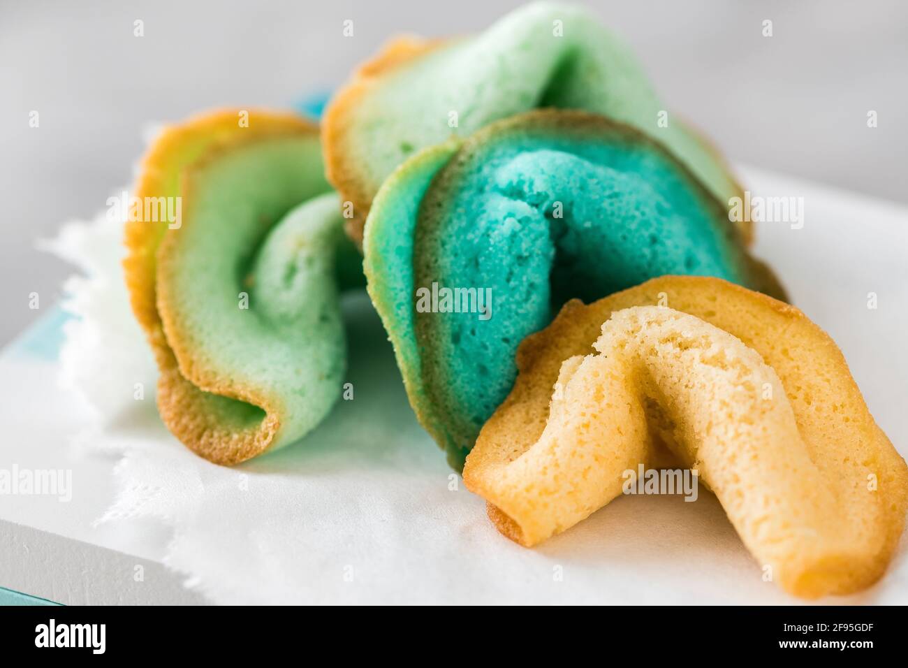 Homemade colored fortune cookies in a row. Closeup Stock Photo - Alamy