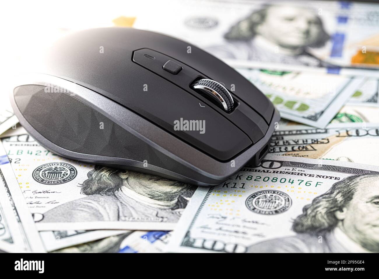 Wireless mobile mouse on 100 dollar background for design purpose Stock ...