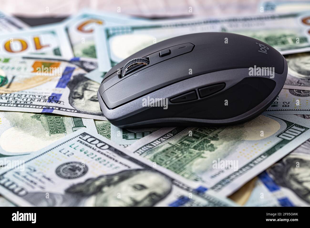 Wireless mobile mouse on 100 dollar background for design purpose Stock ...