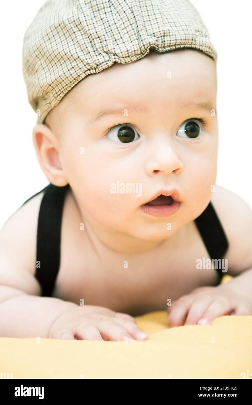 A cute little baby child with brown eyes. Isolated on a white ...