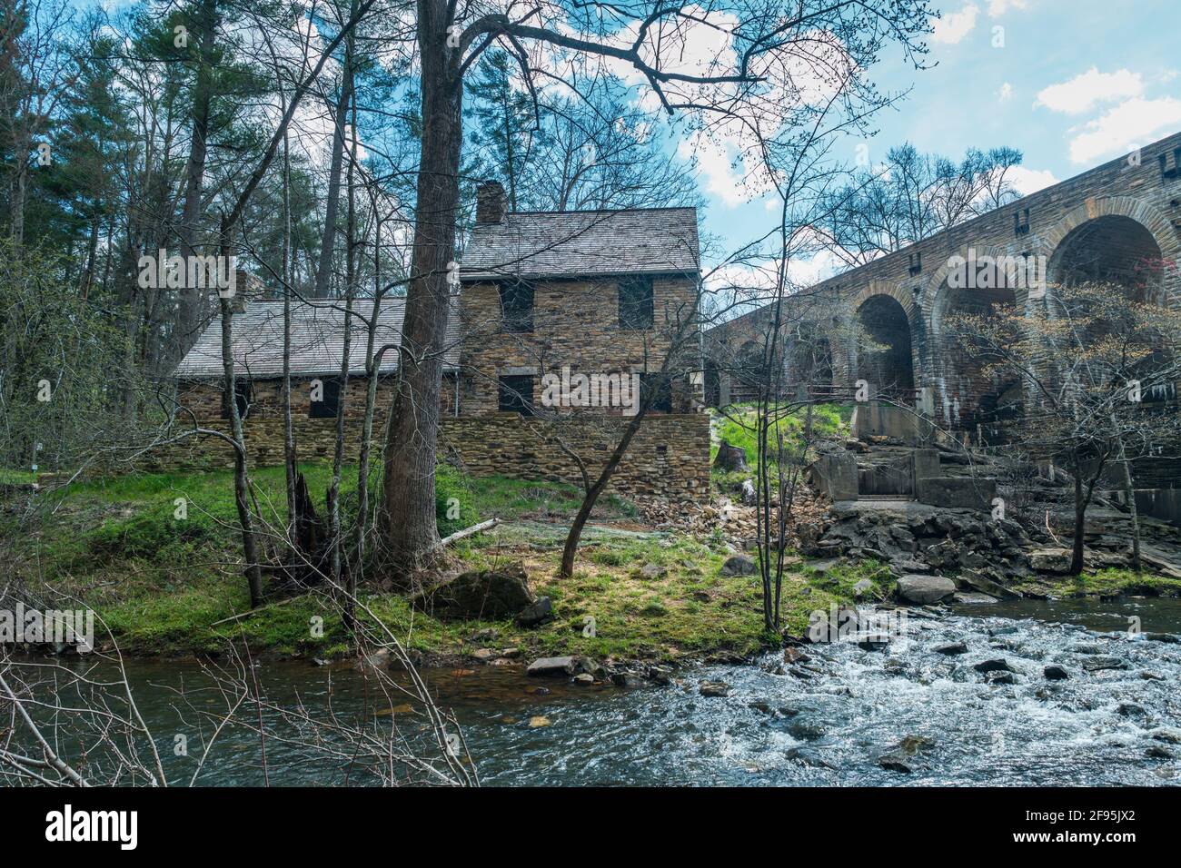 The mill house lodge behind the bridge with the dam along the stream ...