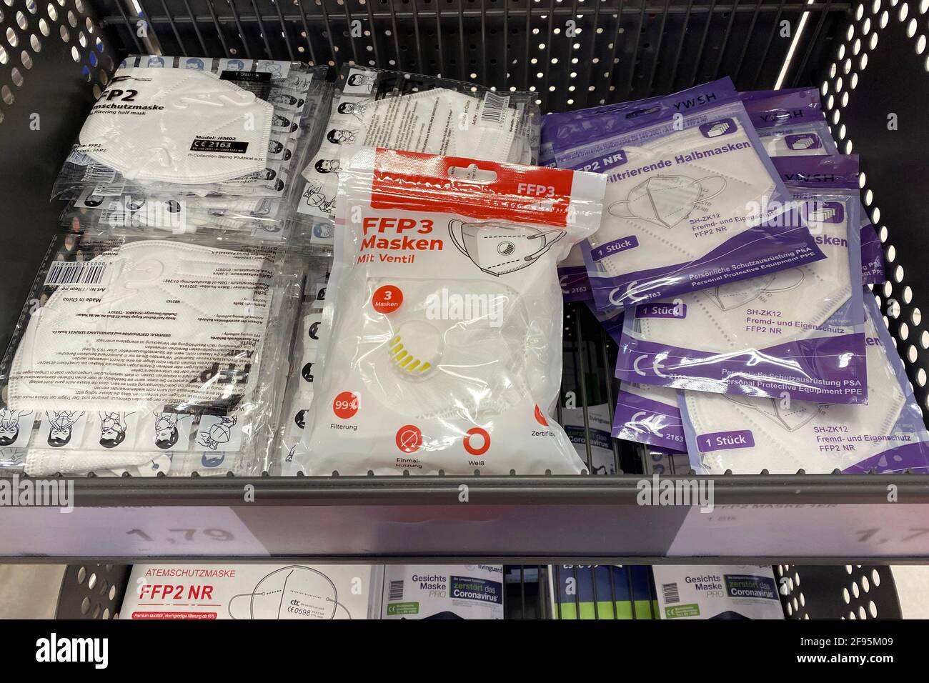 FFP2 and FFP3 masks are packed on a shelf in a branch of the Rossmann ...