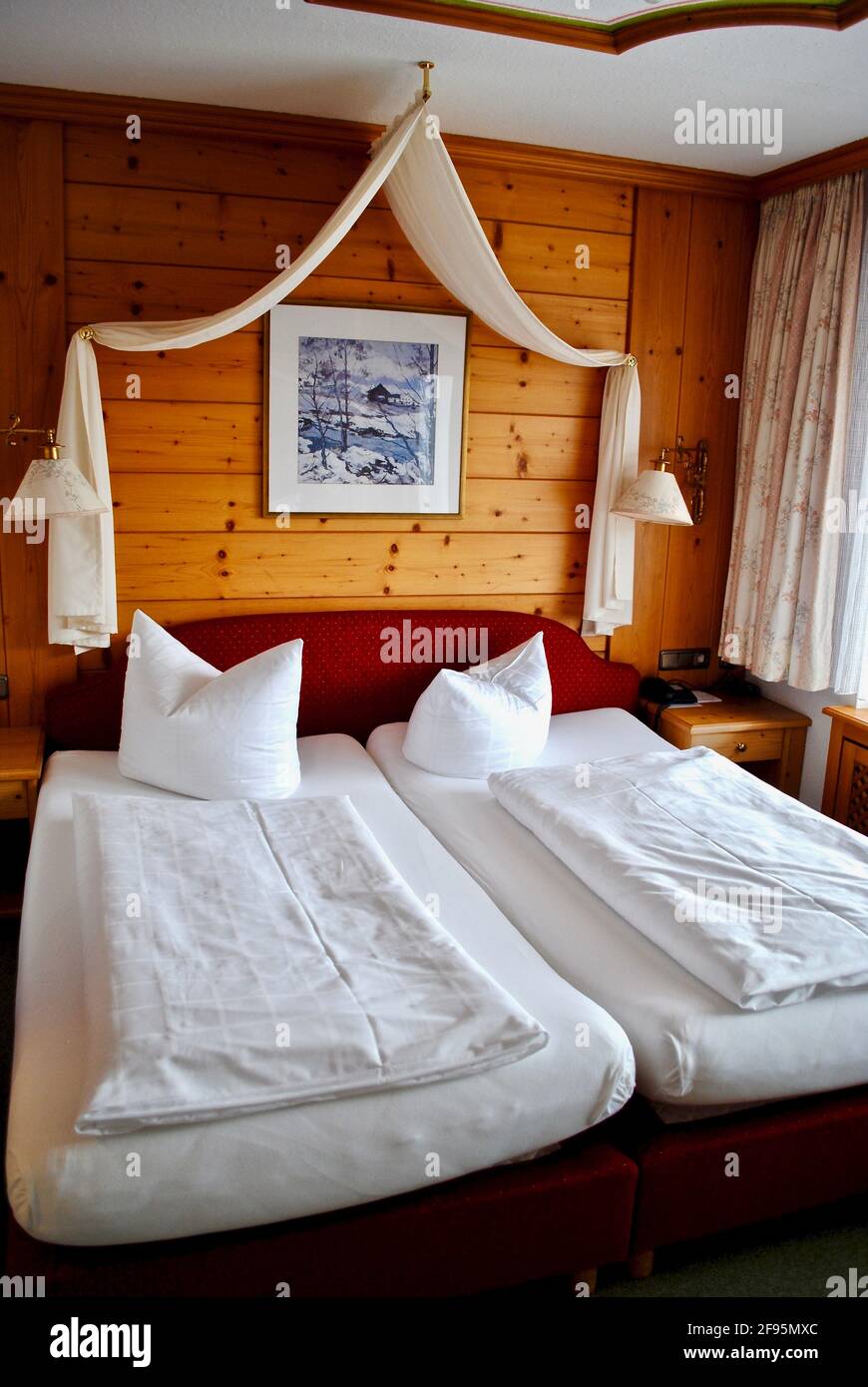 Traditional European style bedding arrangement. Two mattresses with ...