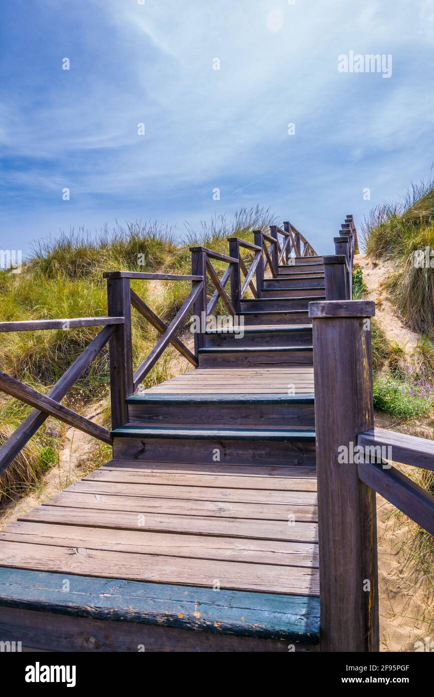 A wooden bridge over sand dunes at Cala Mesquida, Mallorca, Spain Stock ...