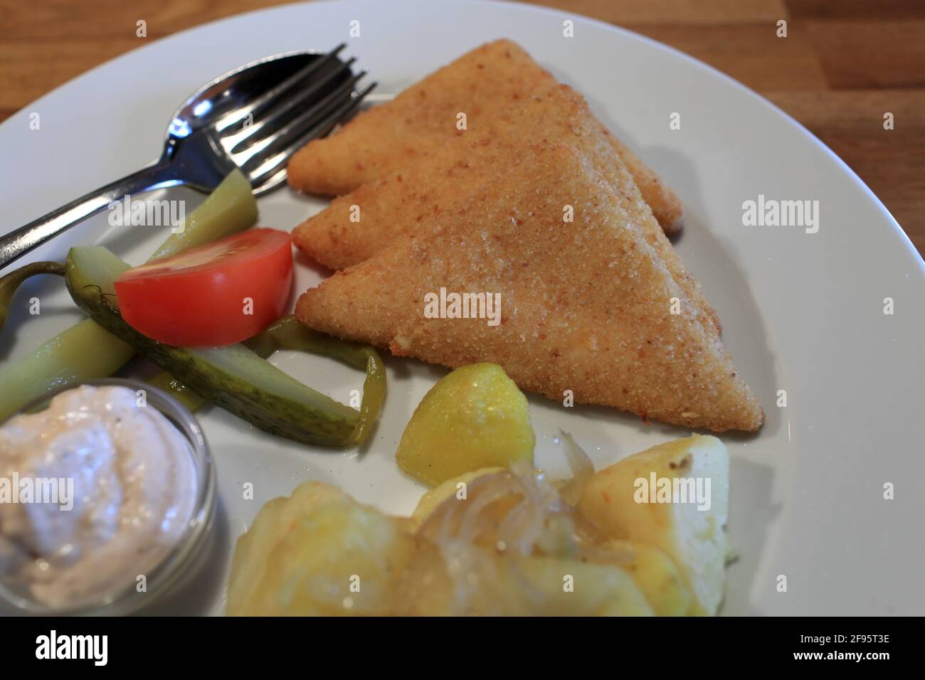 Czech fried cheese on a plate in a restaurant Stock Photo - Alamy