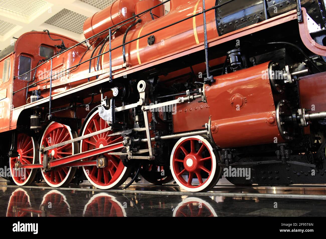 Red vintage steam locomotive in a museum Stock Photo - Alamy