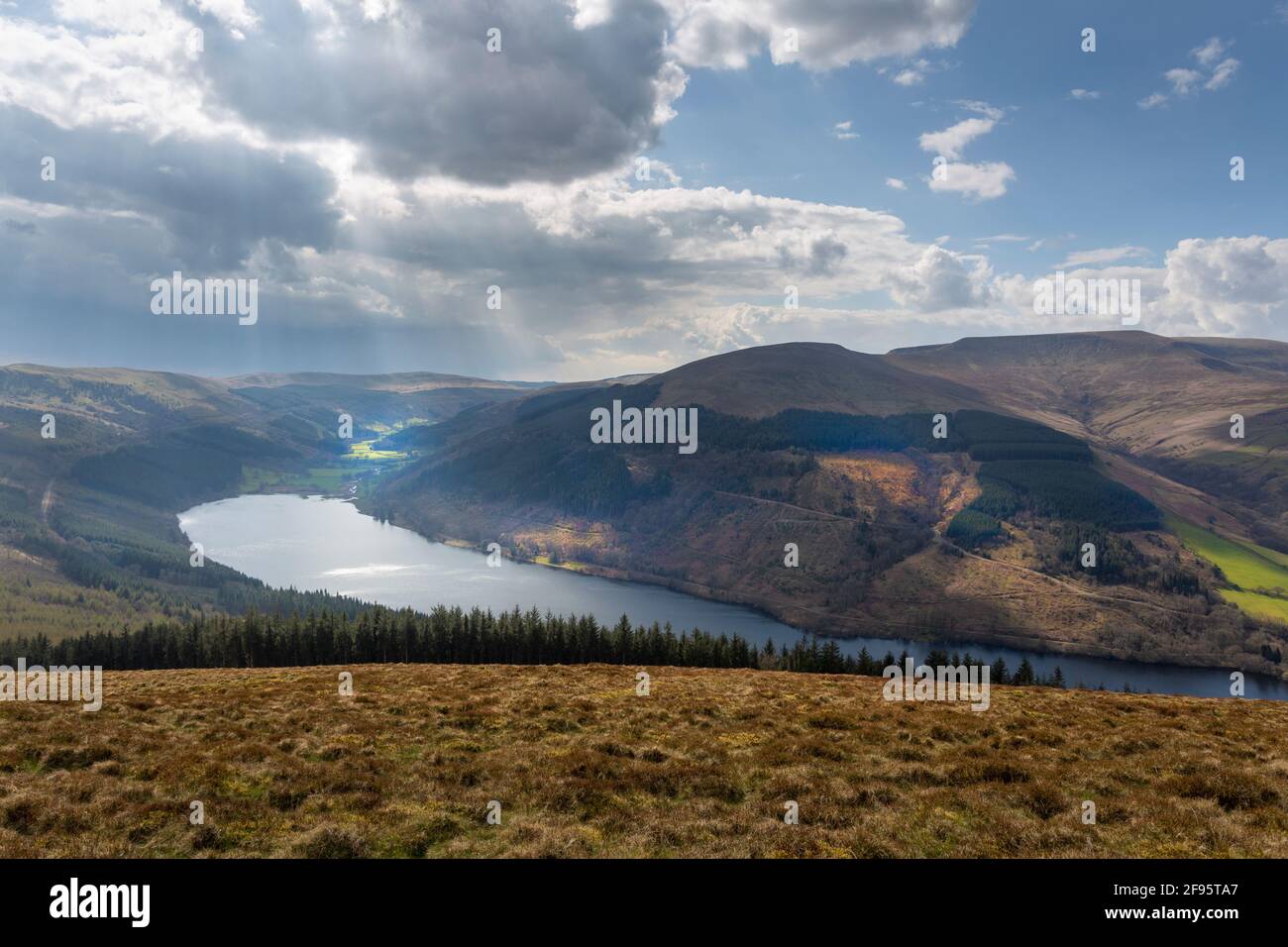Sunshine and rain clouds over the Talybont reservoir in the Brecon ...