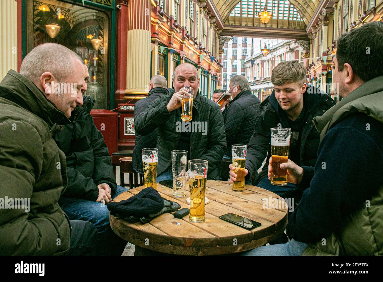LONDON, UK. 16 April 2021. People drinking outside pubs in Leadenhall ...