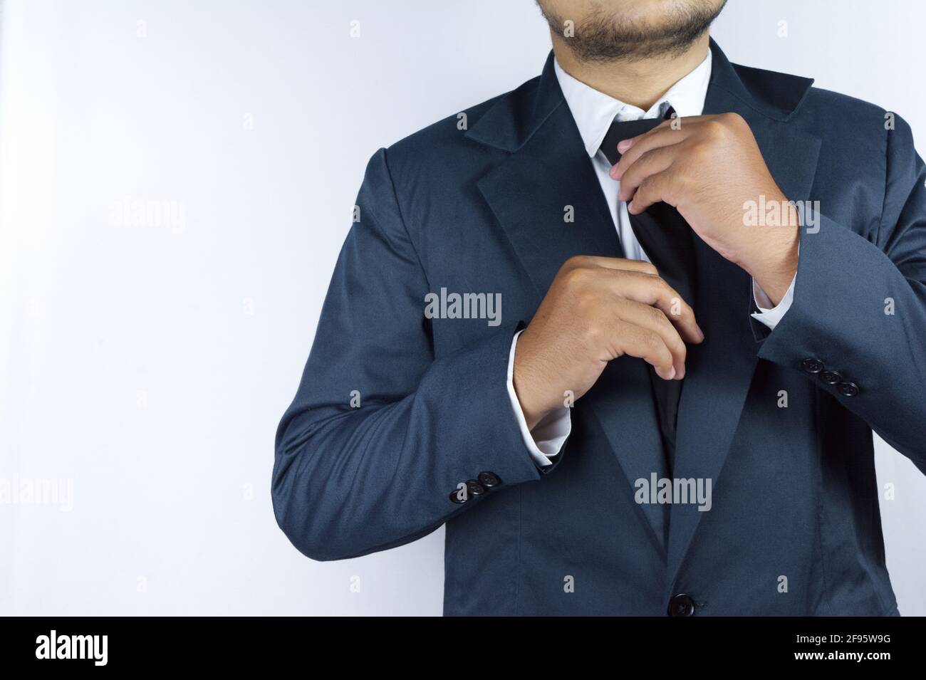 Fixing his tie hi-res stock photography and images - Alamy