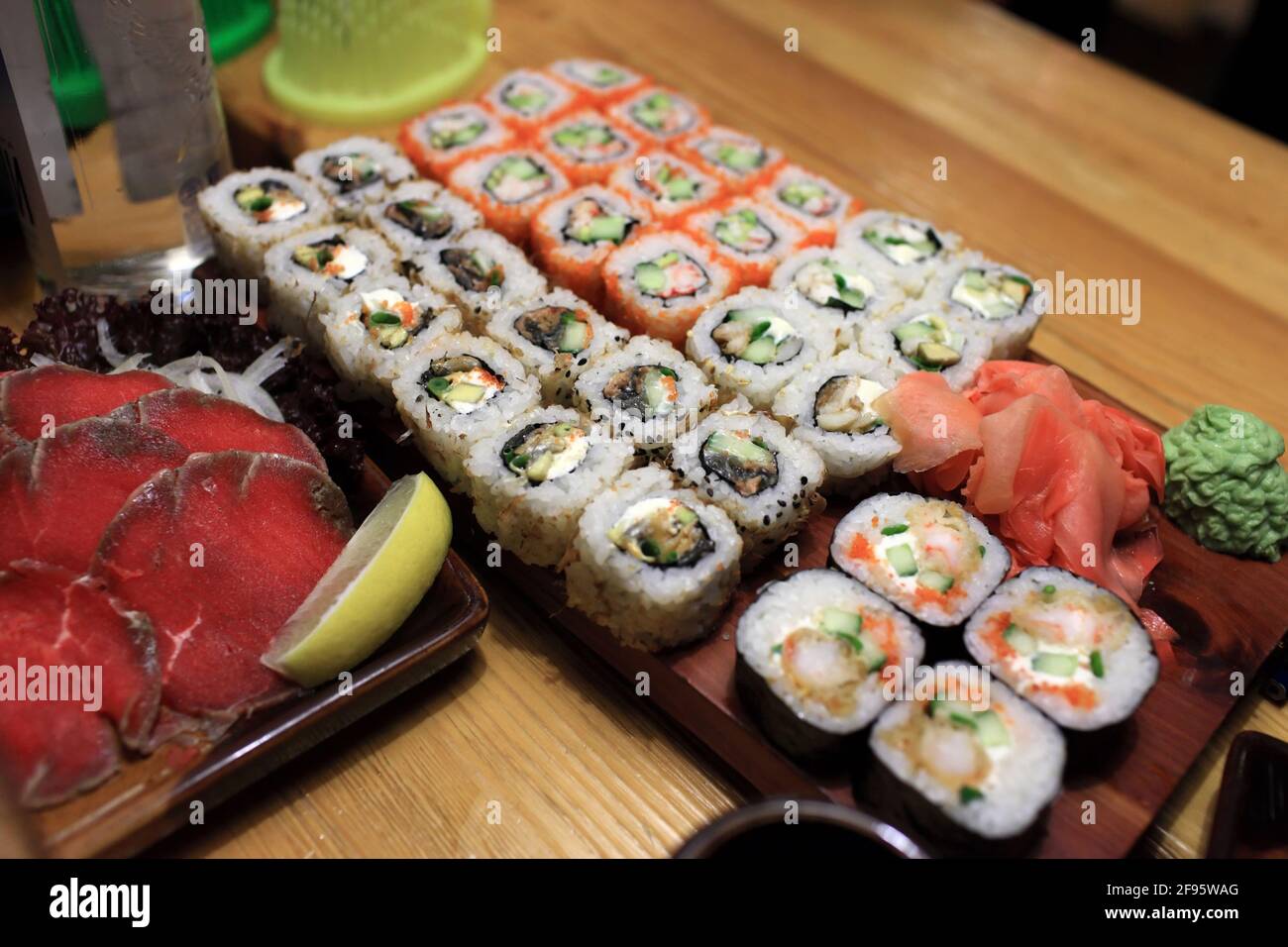 Different sushi on a board in the japanese restaurant Stock Photo - Alamy