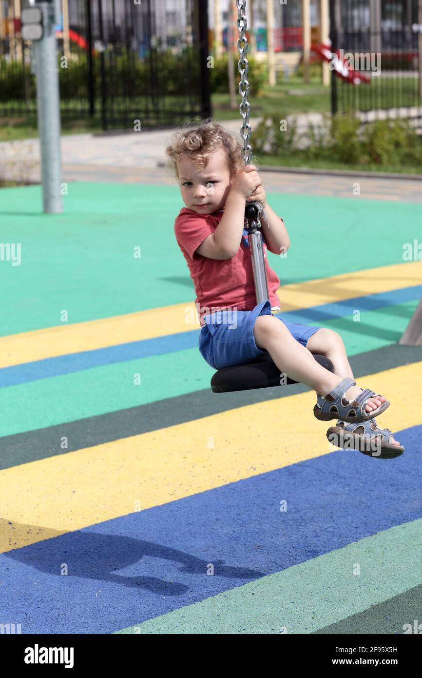 Child is playing at cableway at playground Stock Photo - Alamy