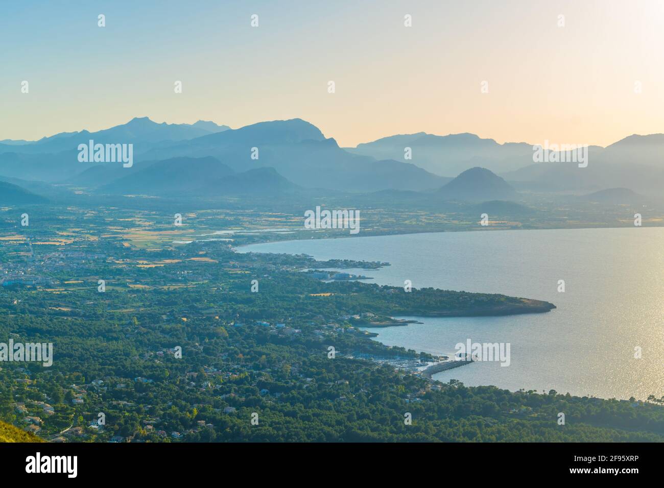 Sunset aerial view of Alcudia town situated between Pollenca and ...