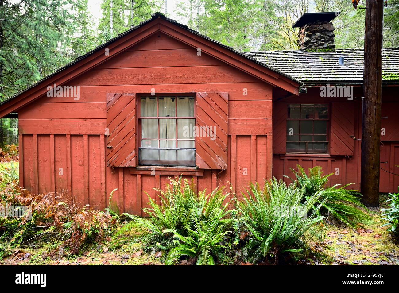 Rustic Red Cabin In National Forest Stock Photo - Alamy