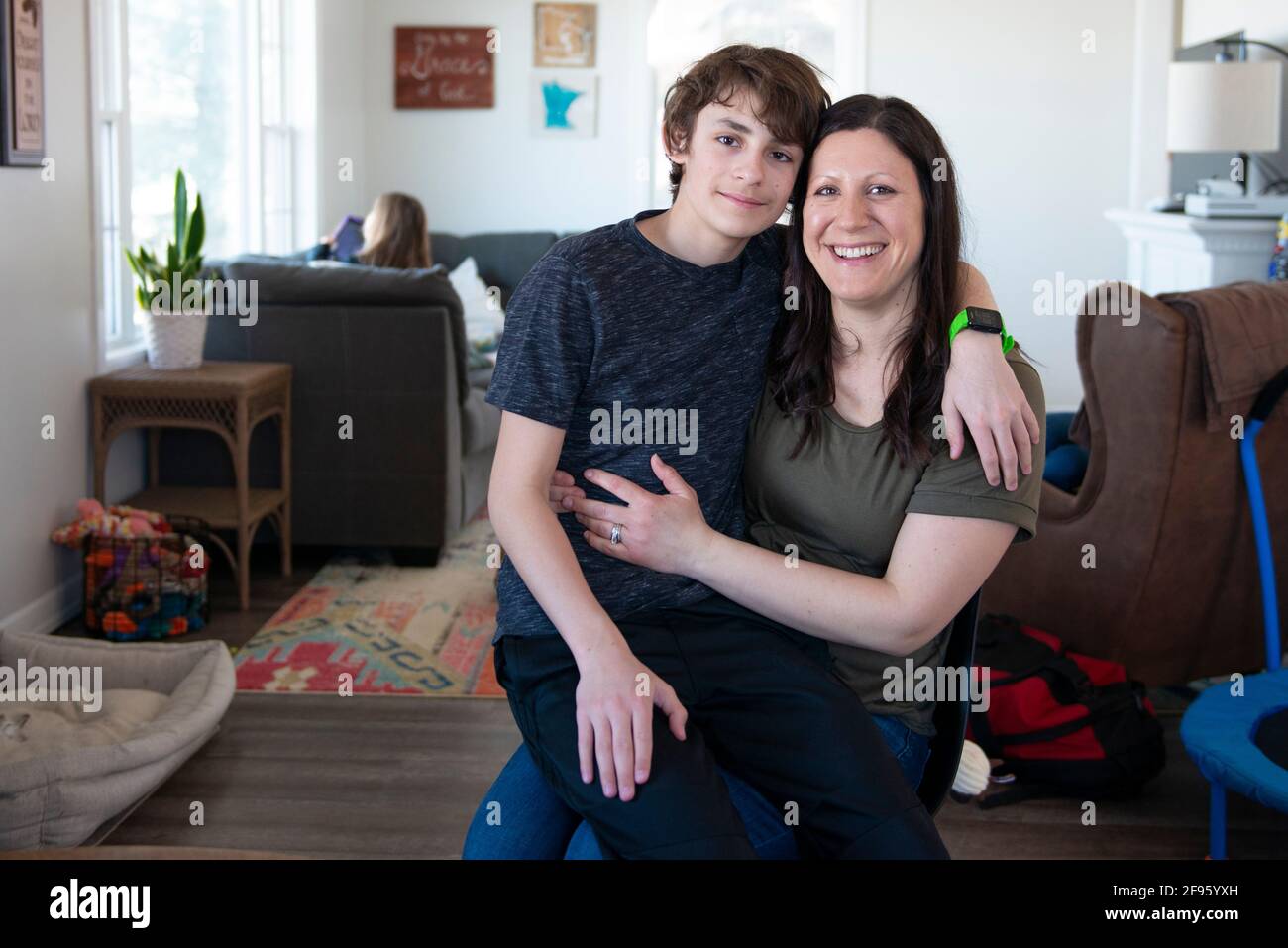 Kid sitting on mom lap hi-res stock photography and images - Alamy
