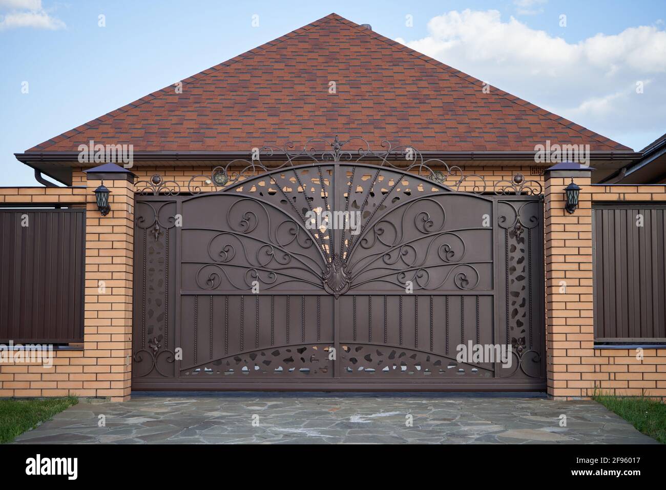 Metal wrought side sliding gates Stock Photo - Alamy