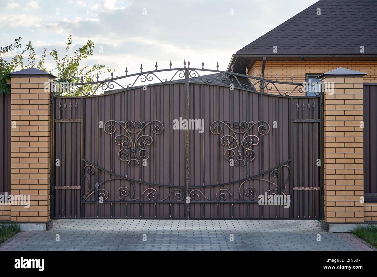 Forged metal gates with ornate lines in a private house Stock Photo - Alamy