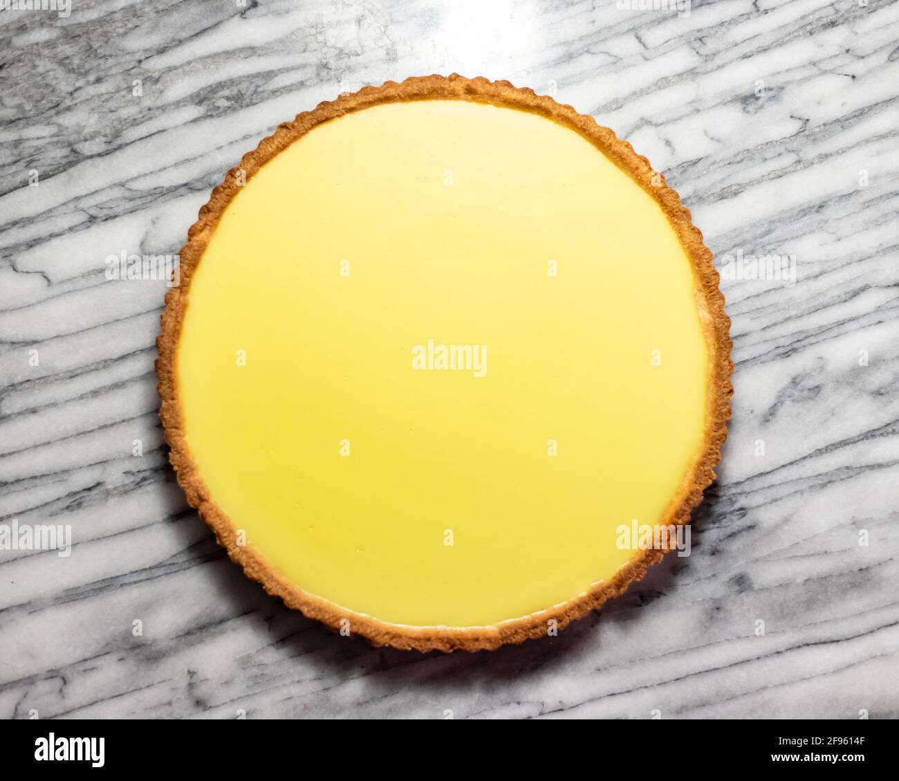 Plain Lemon Tart on White Marble Stock Photo - Alamy