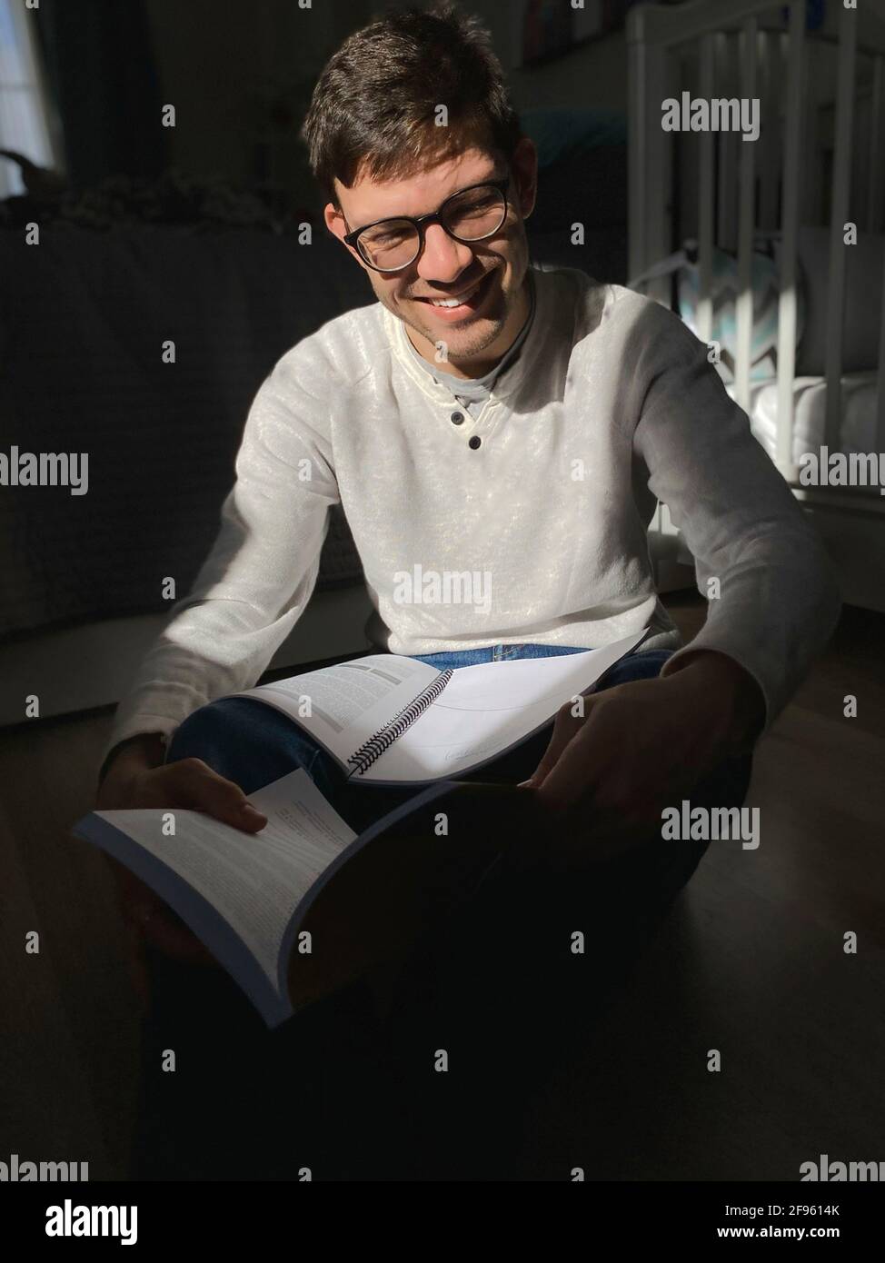 Portrait of happy young man studying at home on self isolation Stock ...