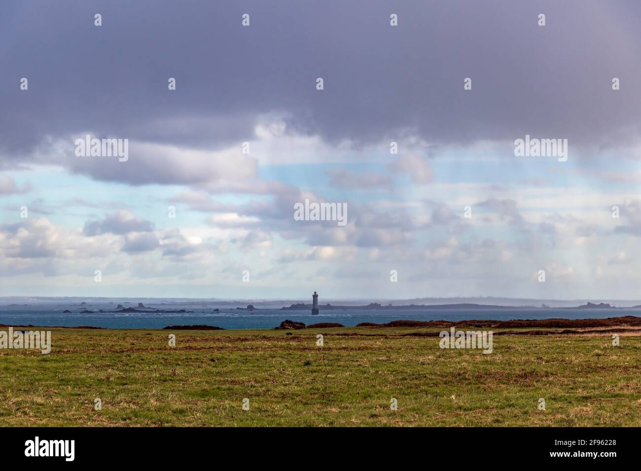 Lighthouses of the Phare de Nividic on the rocky coast of the Ushant ...