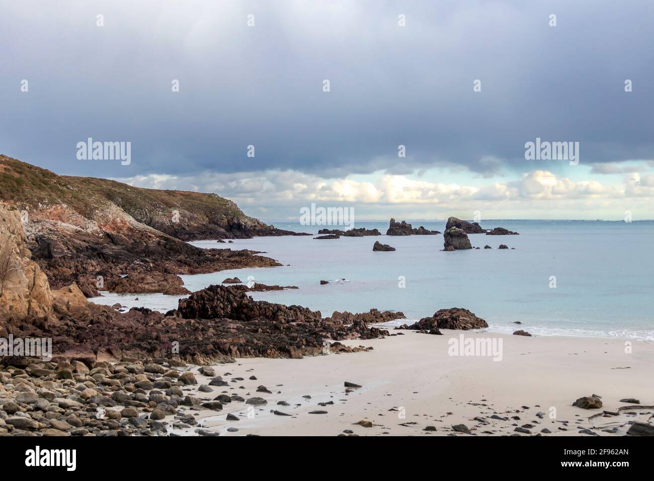 Rocky beach of the French island Ouessant with dramatic sky, Breton ...