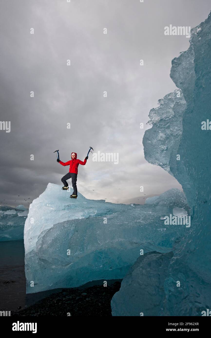 Mature woman climbing iceberg hi-res stock photography and images - Alamy