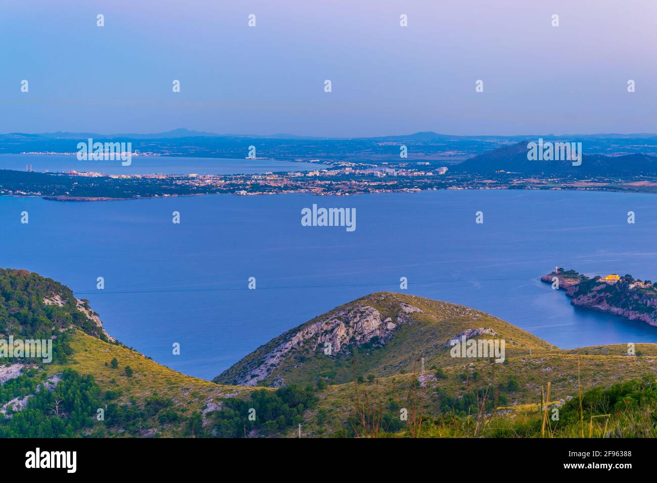 Sunset aerial view of Alcudia town situated between Pollenca and ...