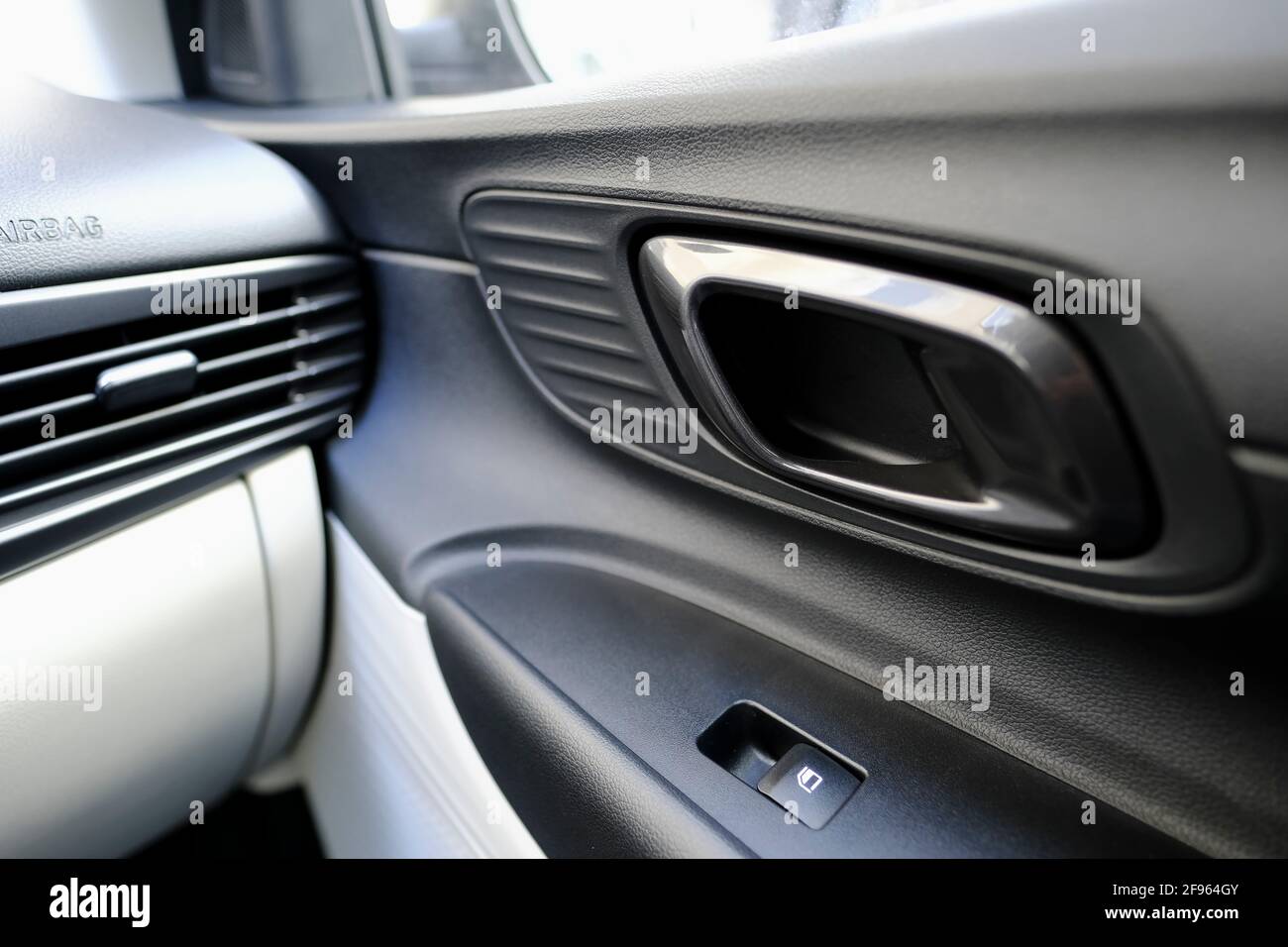 Interior door handle detail of a modern car Stock Photo - Alamy