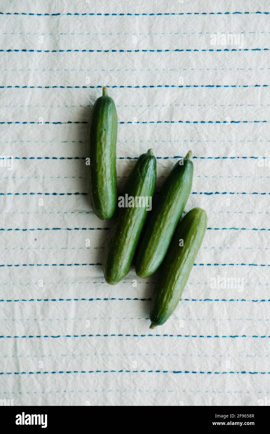 Fresh green baby cucumbers hi-res stock photography and images - Alamy