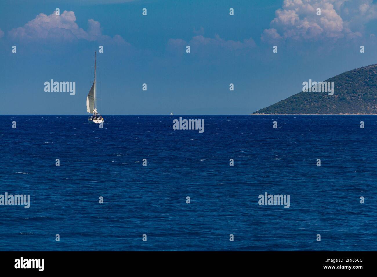 Seascape - a snow-white sailing yacht floats on the blue water of the ...