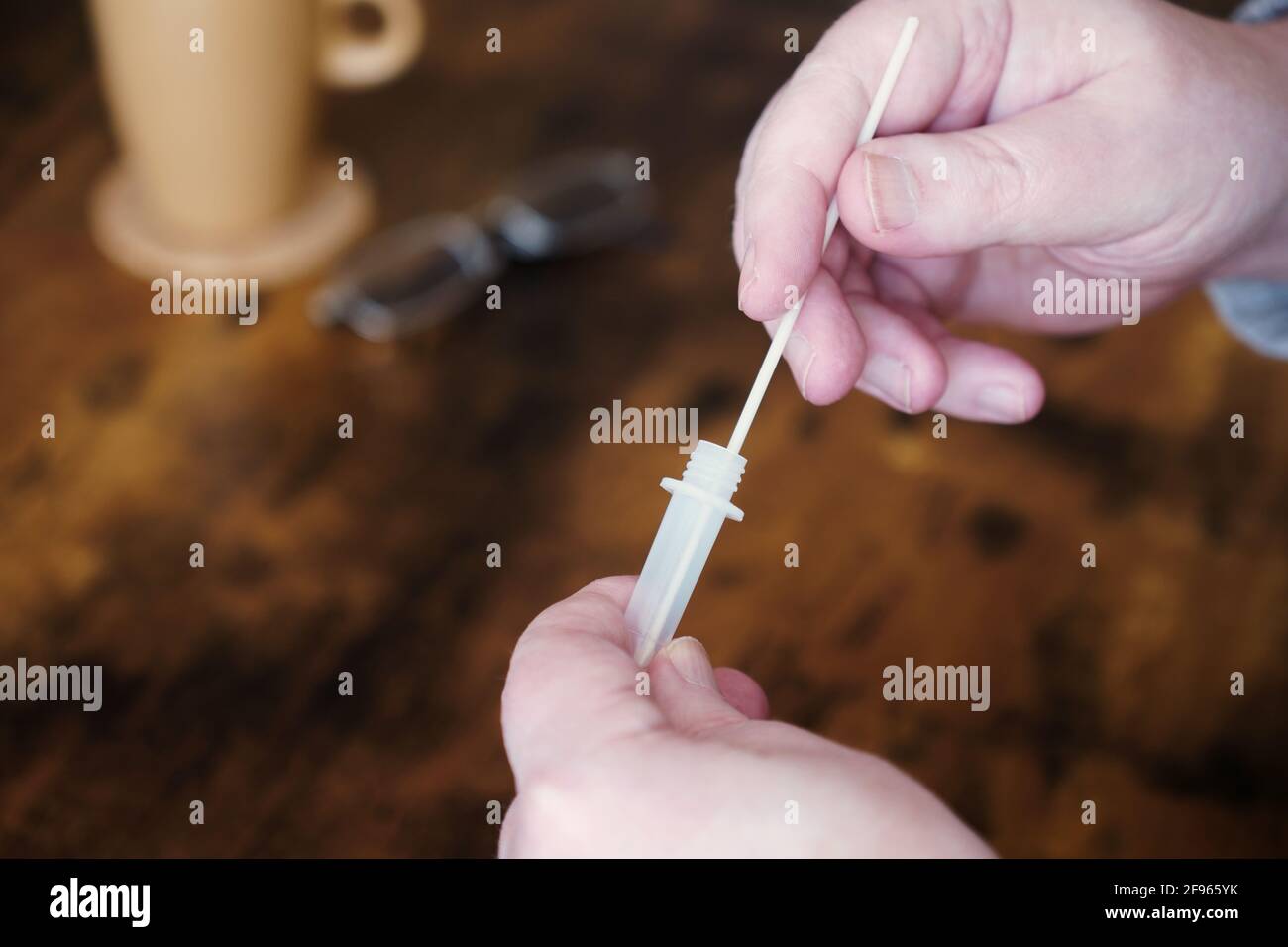 hands using corona virus covid-19 rapid antigen self test kit at home ...