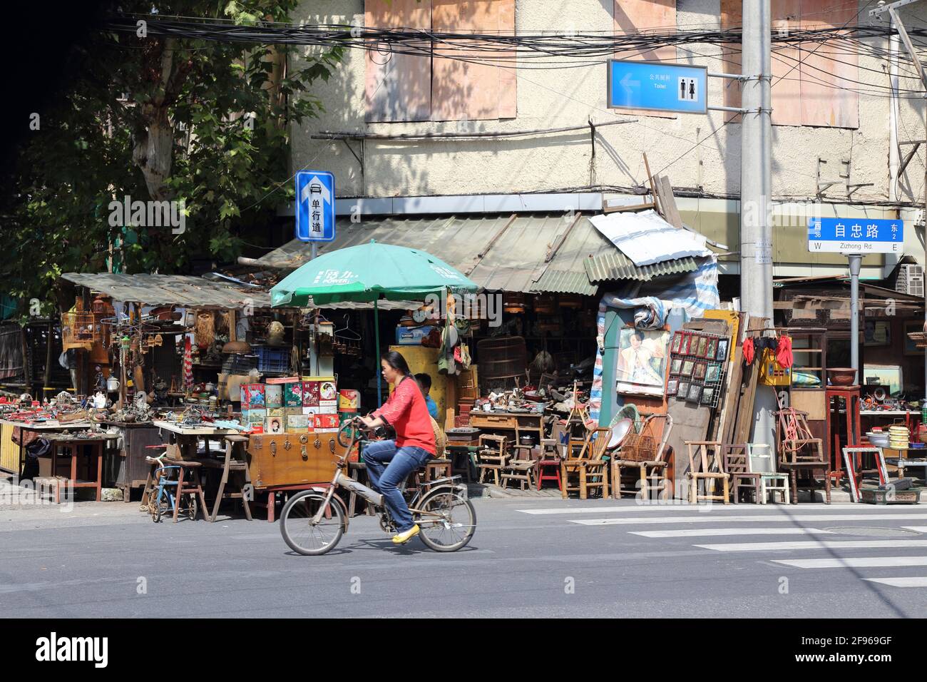 Dongtai rd antiques woman on bicycle hi-res stock photography and ...