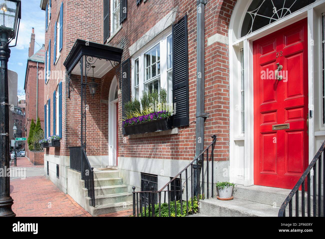 Boston, MA - April 8 2021: Front of brownstone apartment brick building ...