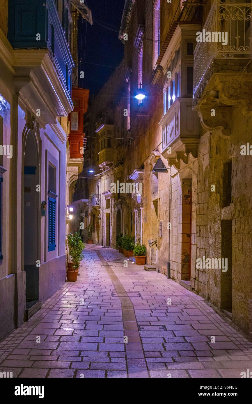Night view of a narrow street in Birgu, Malta Stock Photo - Alamy