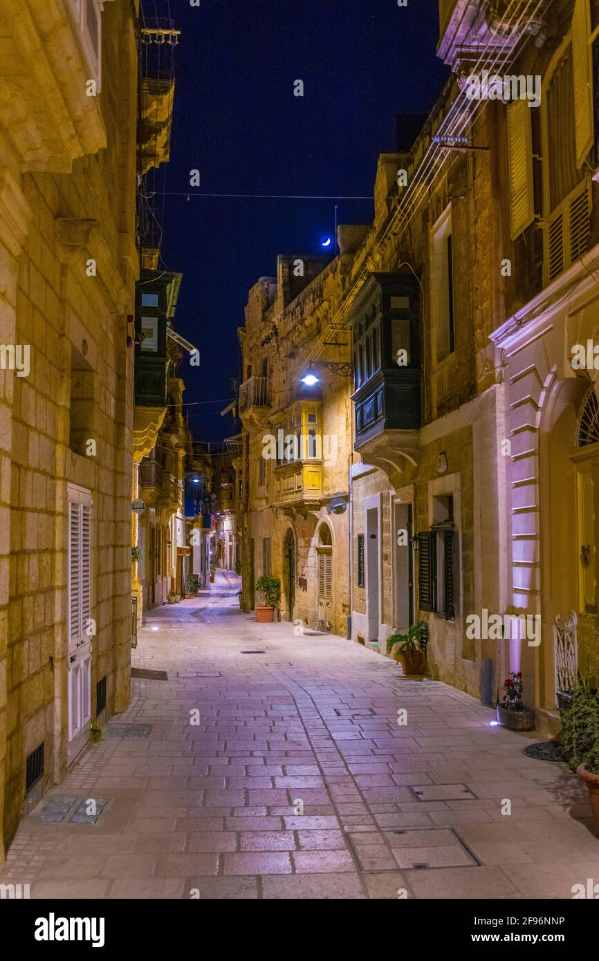 Night view of a narrow street in Birgu, Malta Stock Photo - Alamy