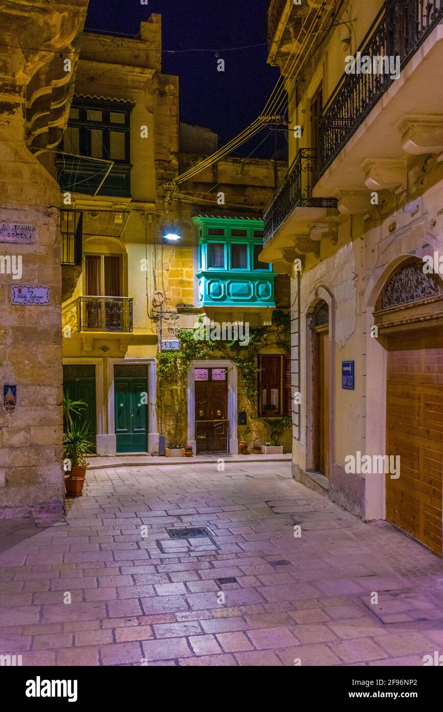 Night view of a narrow street in Birgu, Malta Stock Photo - Alamy