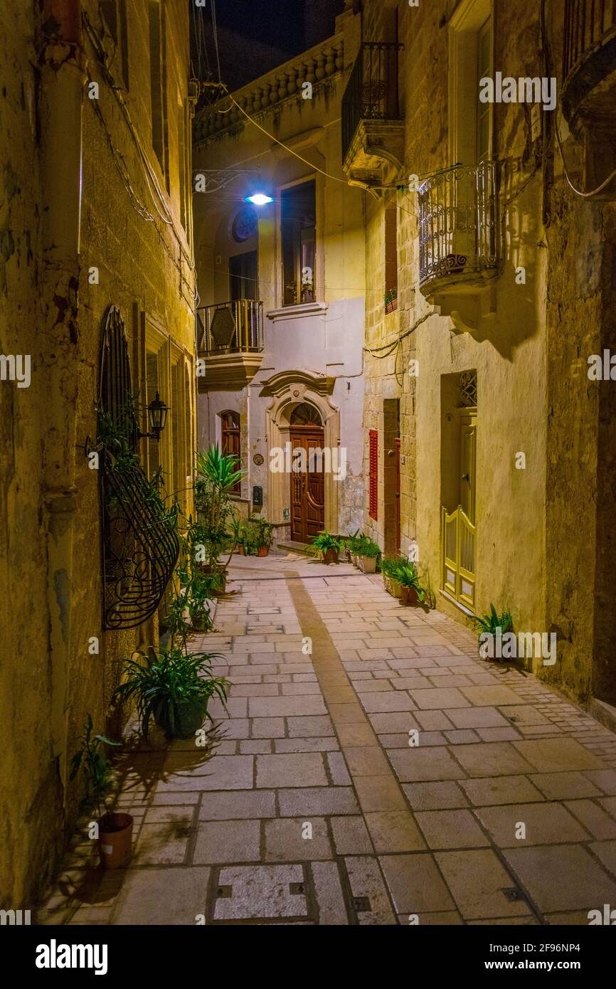 Night view of a narrow street in Birgu, Malta Stock Photo - Alamy