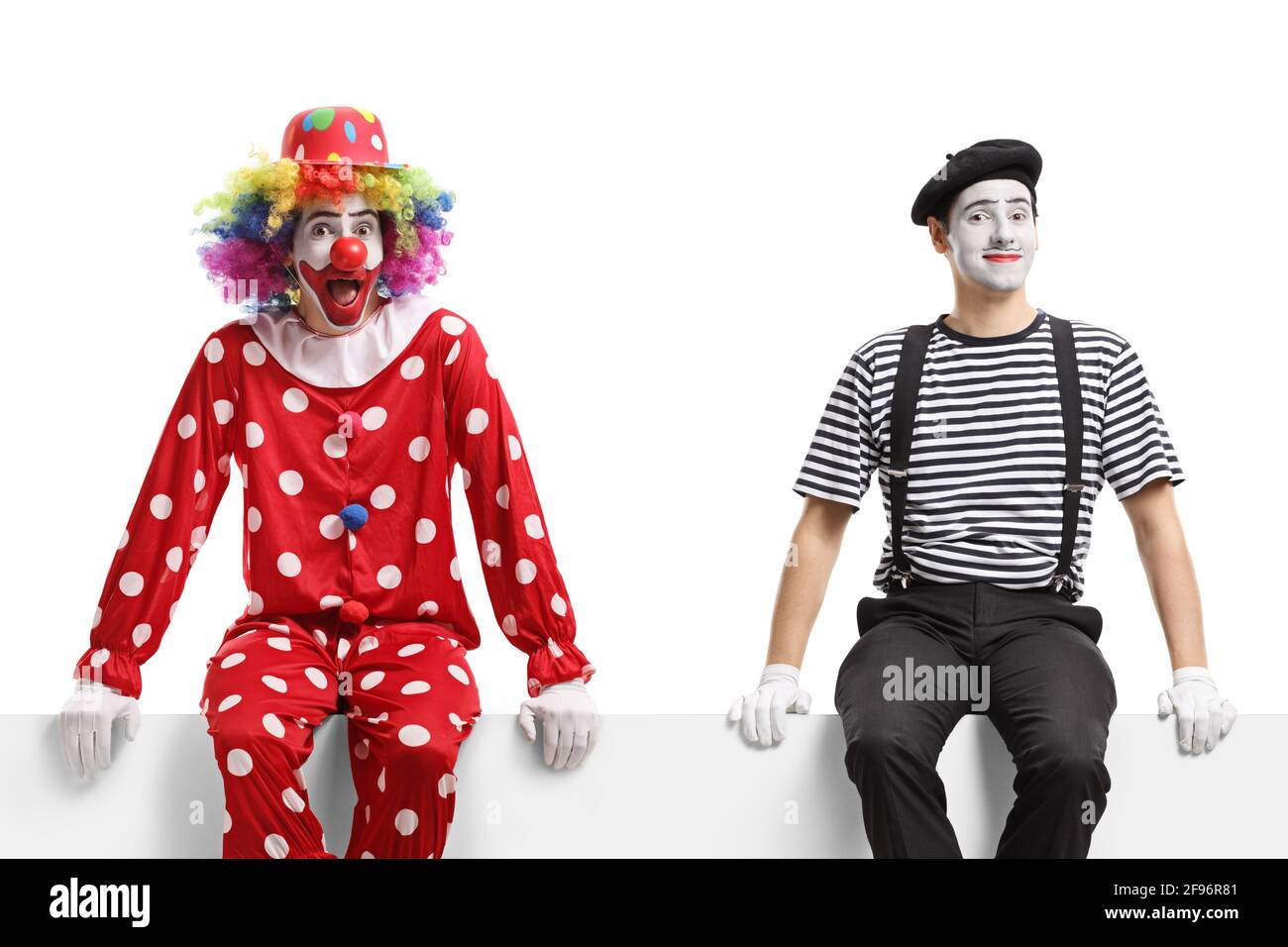 Clown and a mime sitting on a blank panel isolated on white background ...
