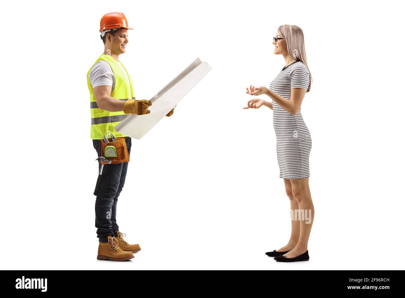 Full length profile shot of a contractor with a blueprint having a ...