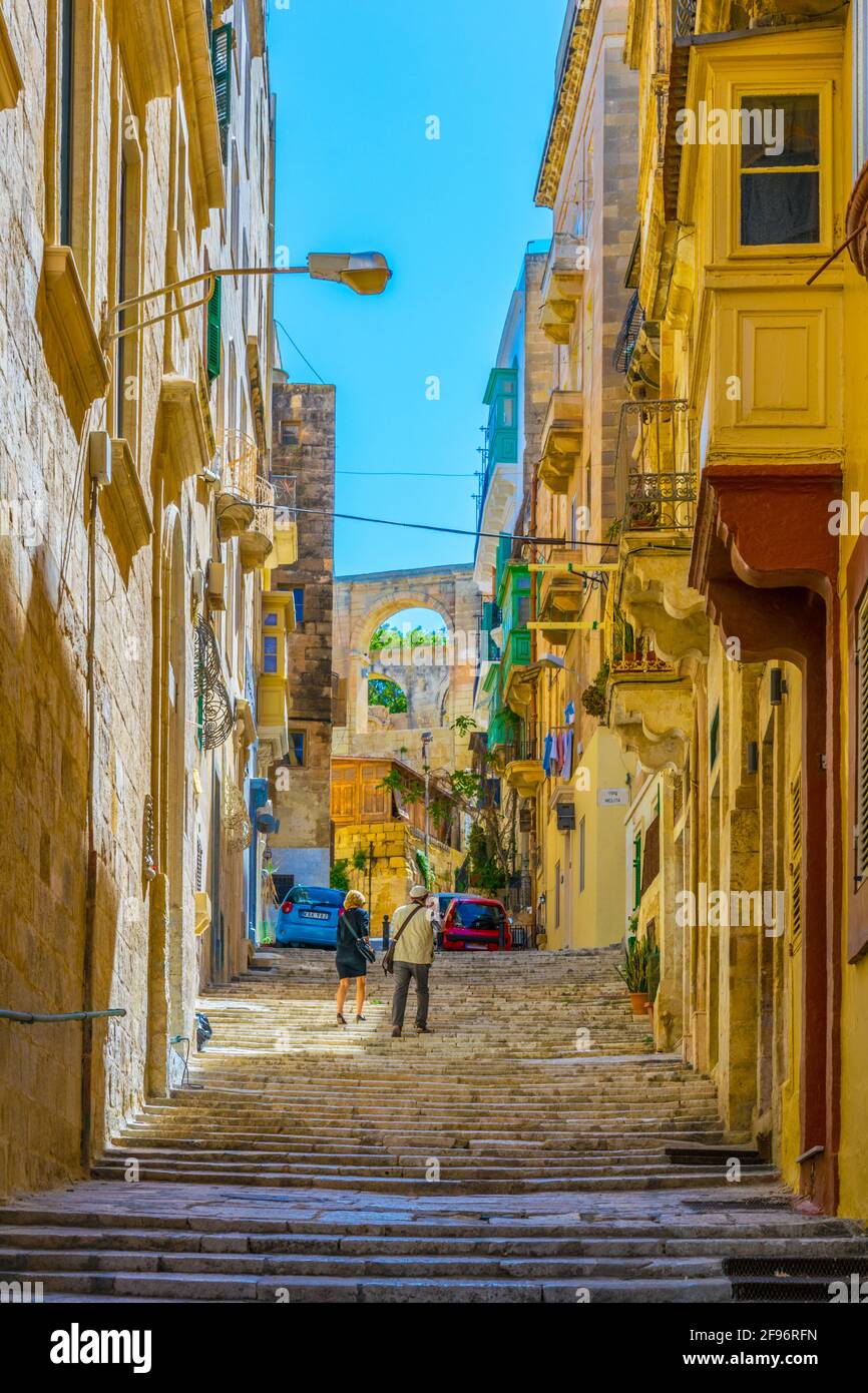 View of a narrow street in the historical center of Valletta, Malta ...