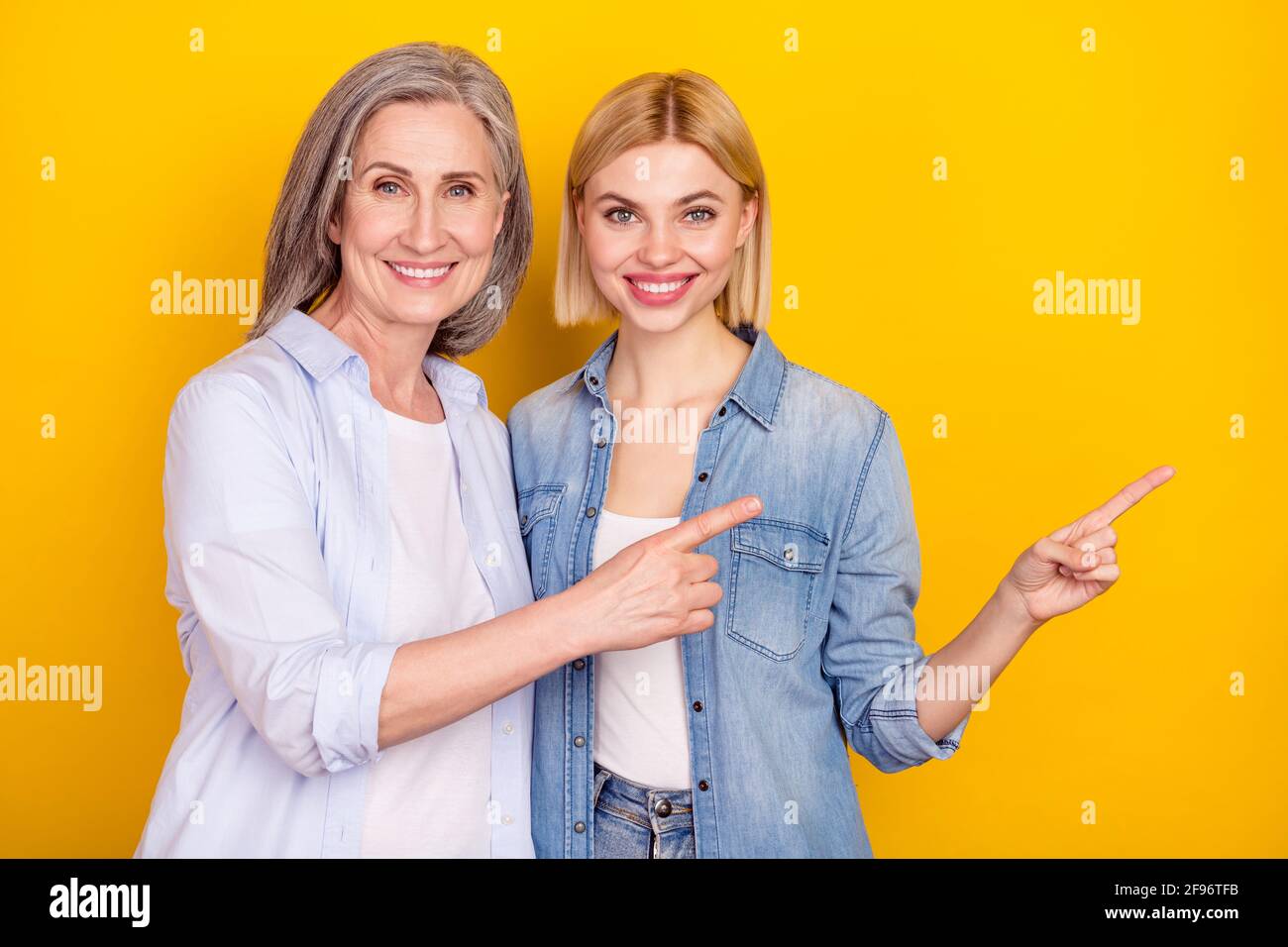 Photo portrait of funky mother and daughter pointing fingers blank ...