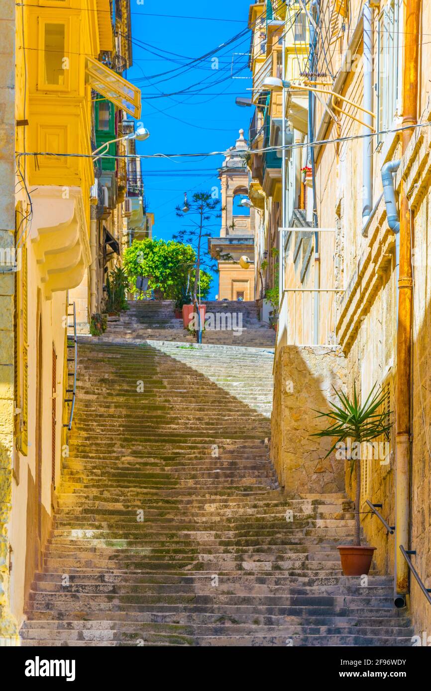 View of a narrow street in the historical center of Senglea, Malta ...