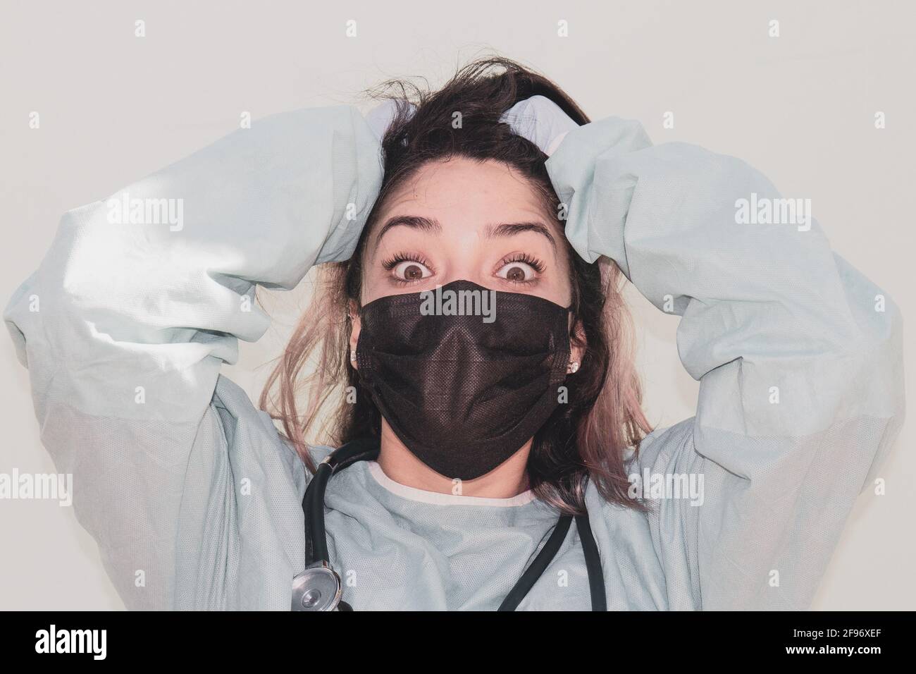 Scared female doctor hi-res stock photography and images - Alamy