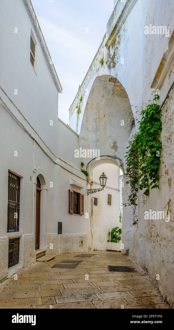 View of a white narrow street in the Italian city ostuni Stock Photo ...