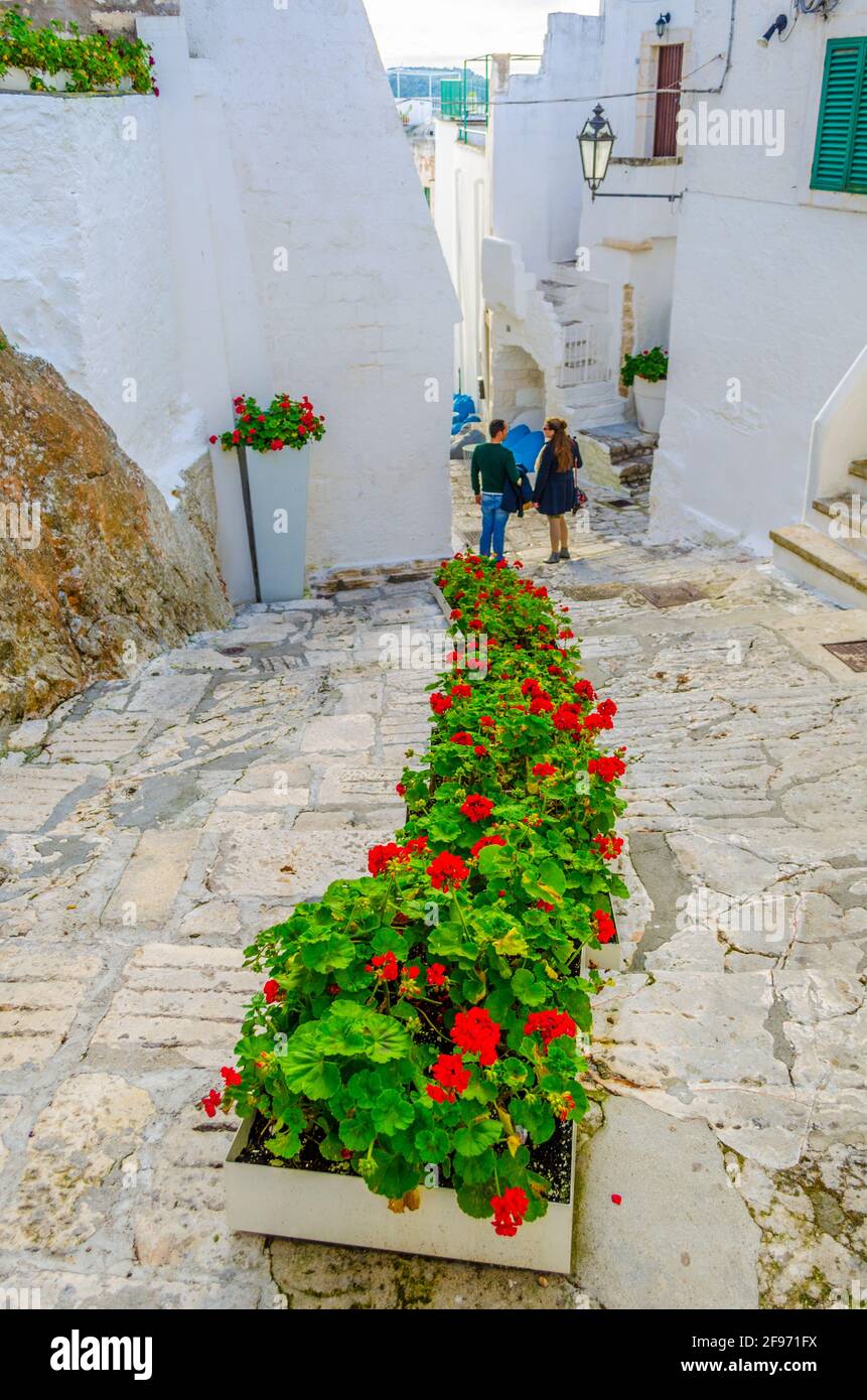 View of a white narrow street in the Italian city ostuni Stock Photo ...